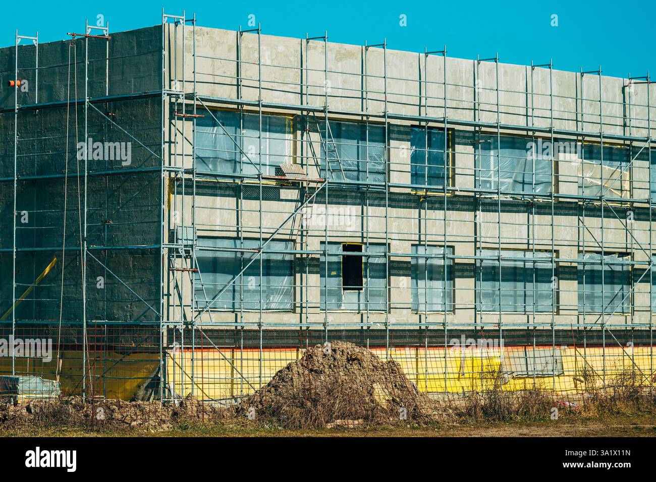 Scaffolding structure on two storey building construction site ...
