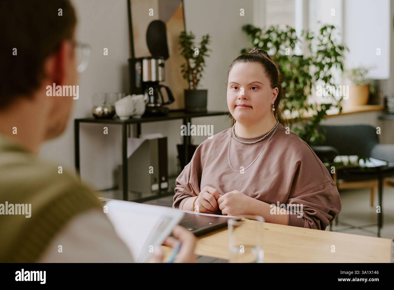 Over shoulder view of unrecognizable male interviewer holding resume ...