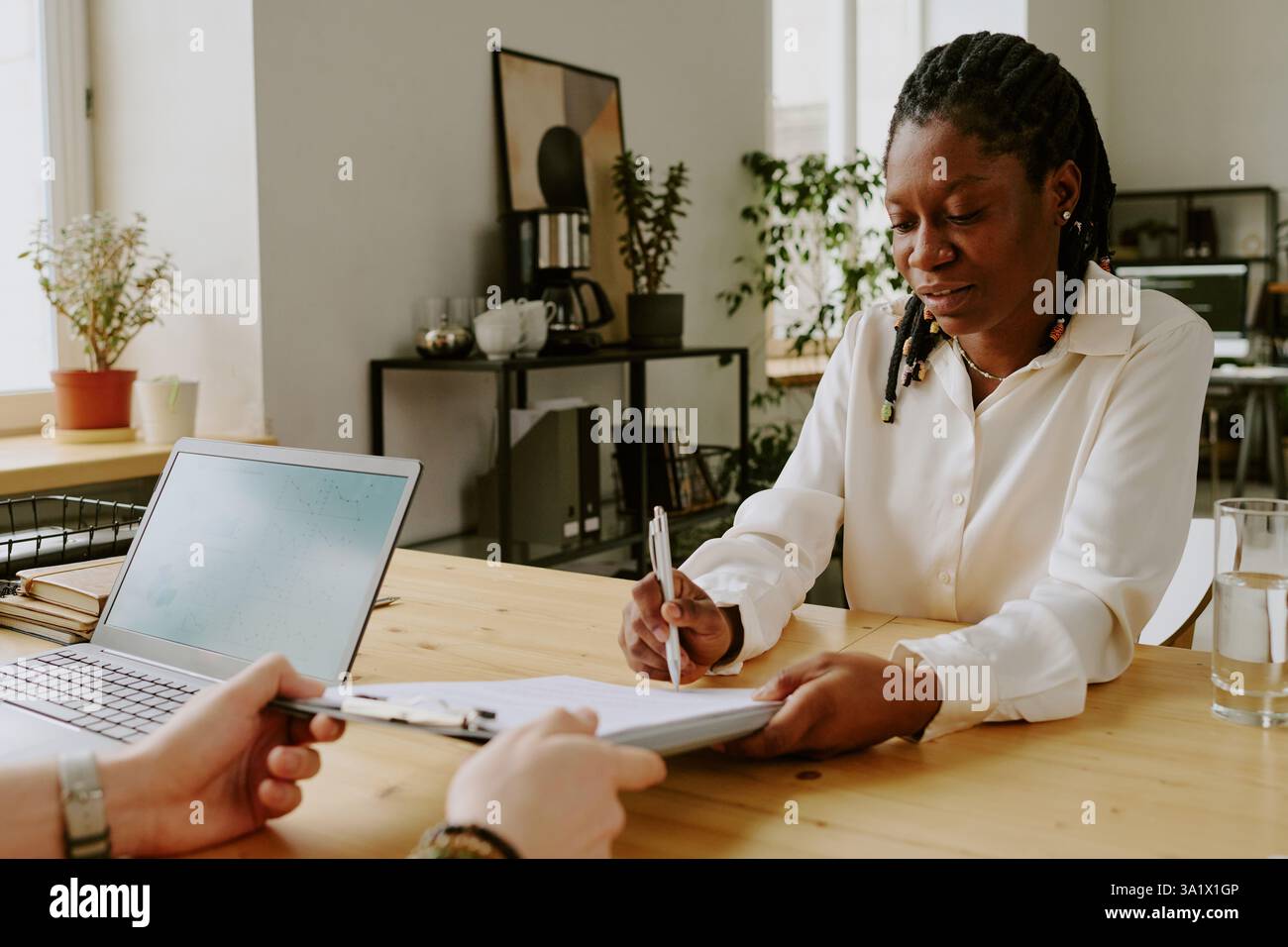 Black woman candidate signing contract hi-res stock photography and ...