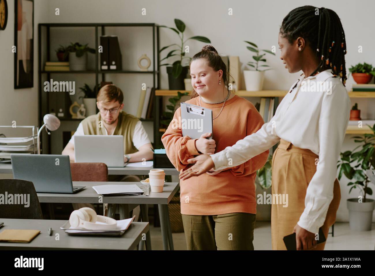 Wide shot of African American boss dressed in smart clothes ...