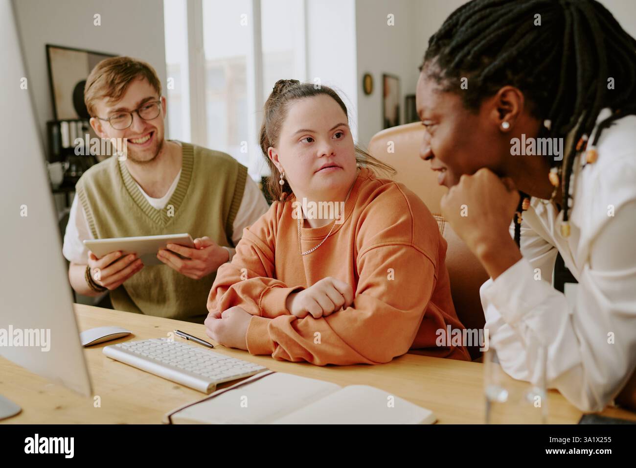 Medium close up of biracial team of talented and young programmers ...