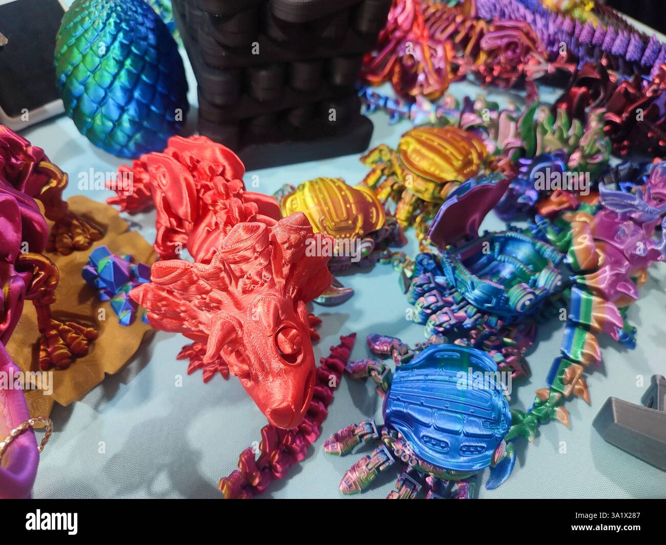 Creative multicolored models printed on 3D printer from molten plastic ...