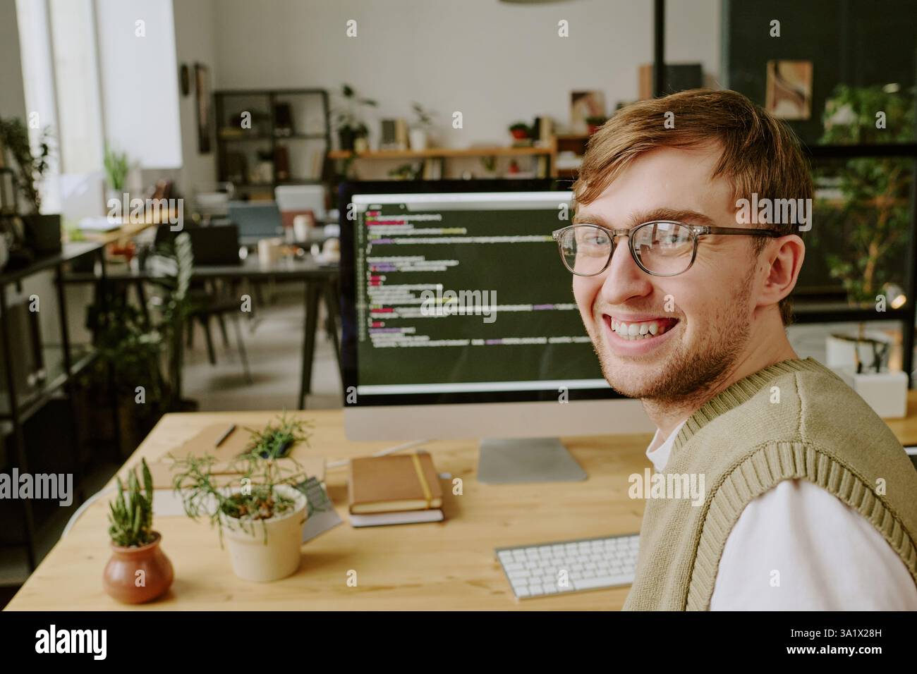 Medium close up of young adult man smiling while taking selfie with ...
