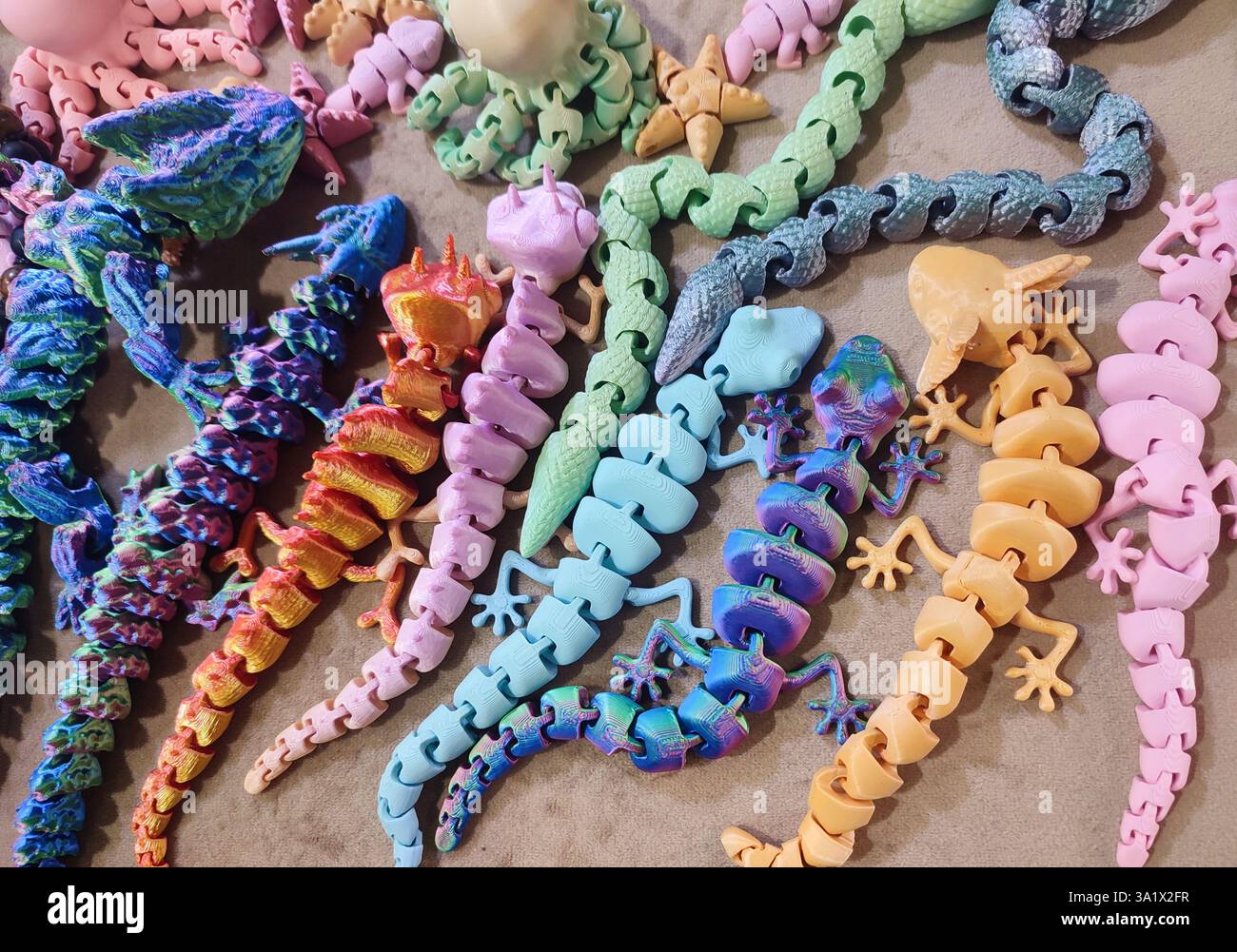 Creative multicolored models printed on 3D printer from molten plastic ...