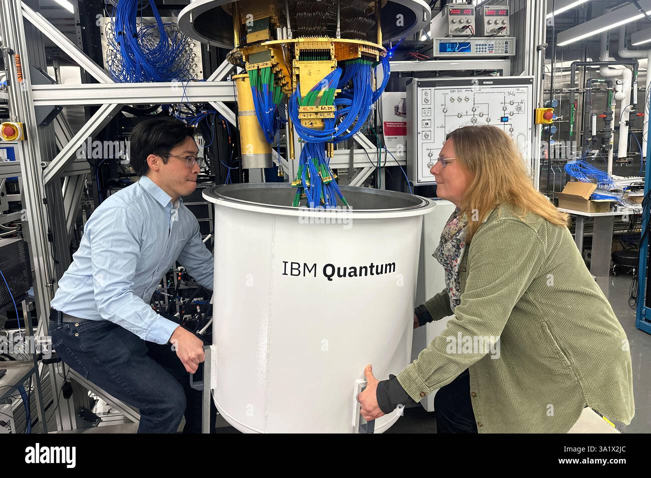 Jerry Chow, IBM Fellow and Director of Quantum Infrastructure, left ...