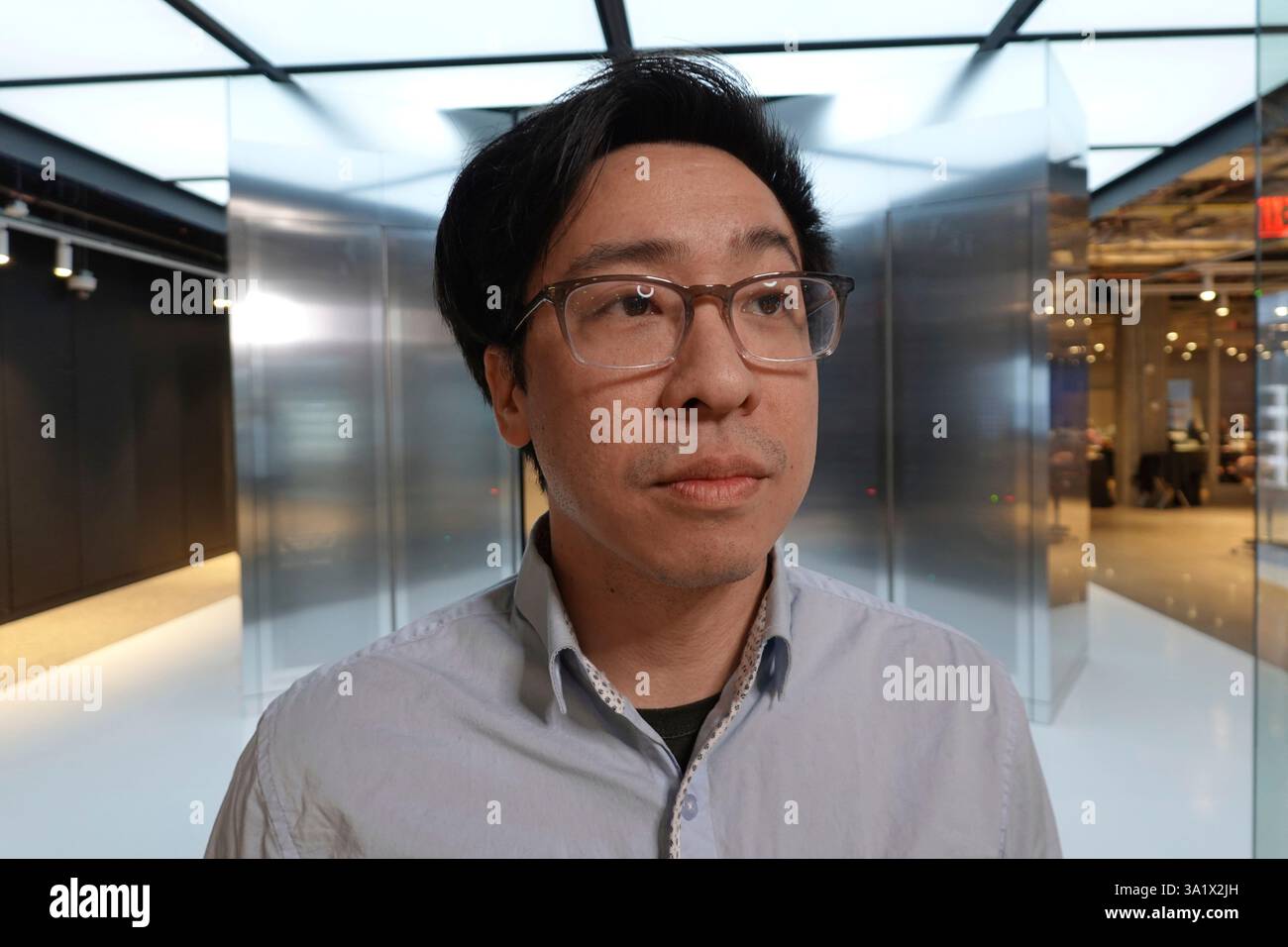 Jerry Chow, IBM Fellow and Director of Quantum Infrastructure, is in front of the IBM Quantum ...