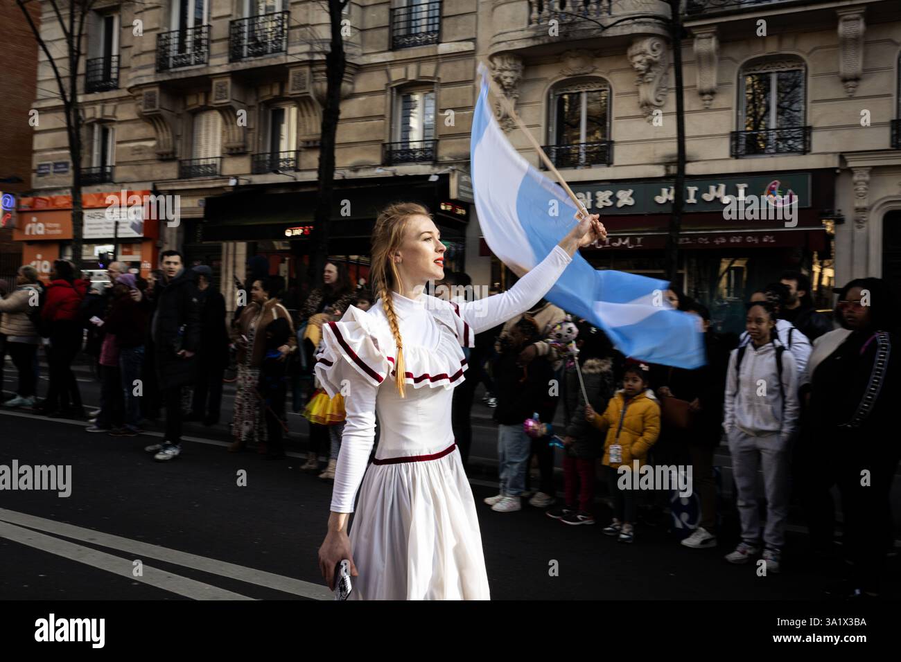 Paris, France. 2nd Mar, 2025. A woman waves an Argentina flag during ...