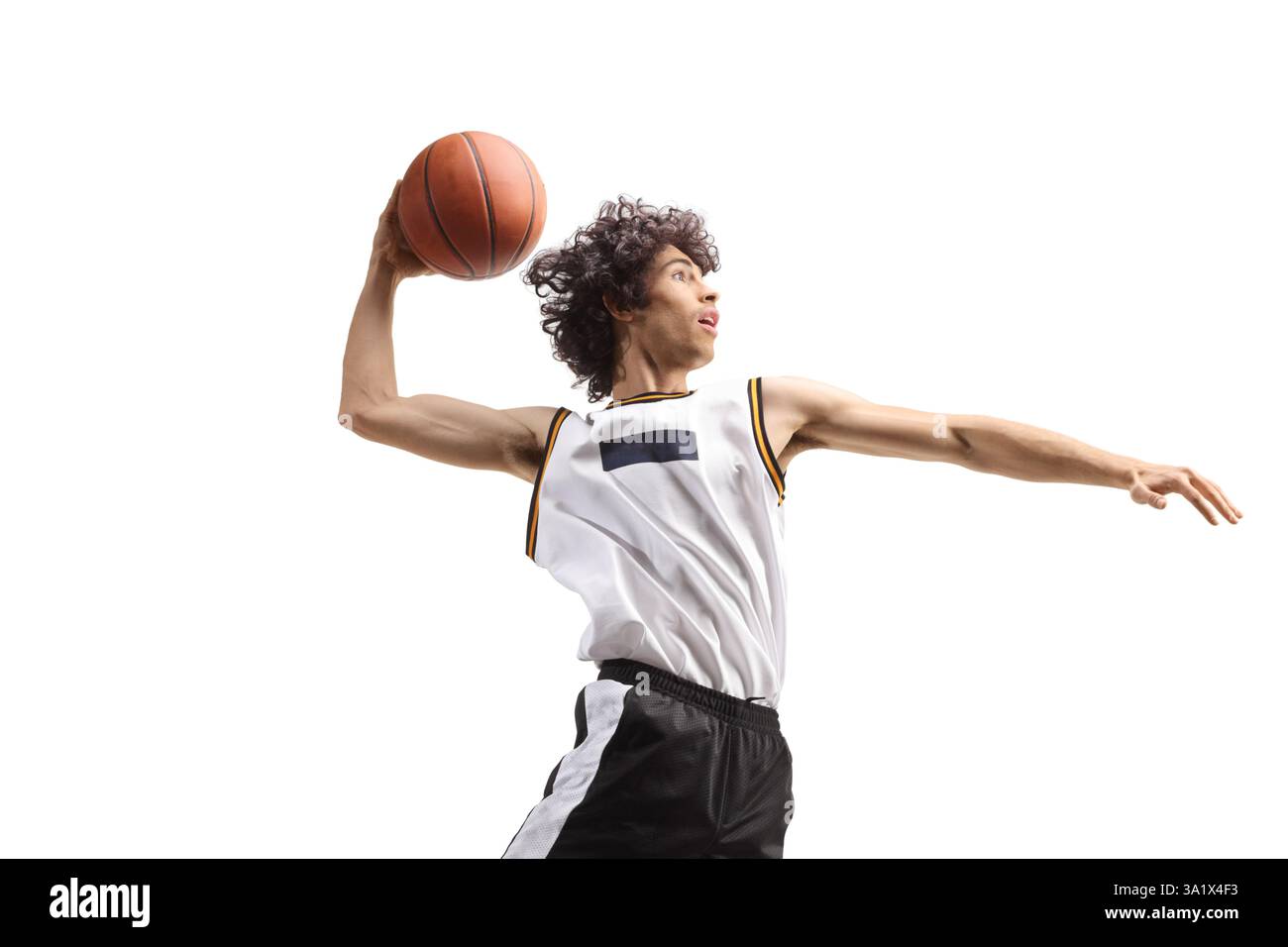 Basketball player up and a slam dunk pose isolated on white background ...