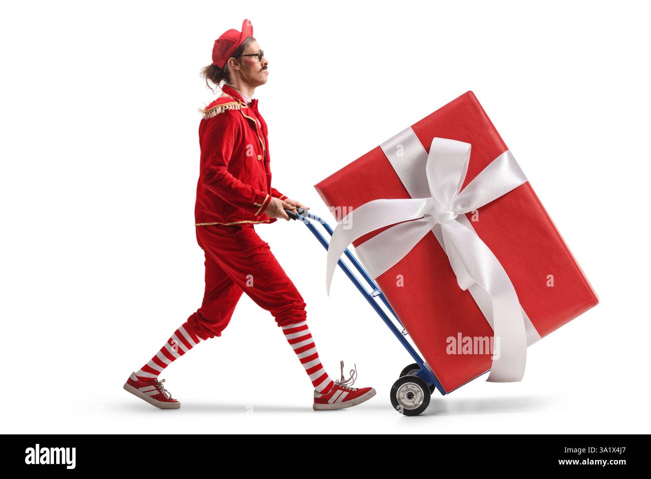 Entertainer pushing a big present box isolated on white background ...