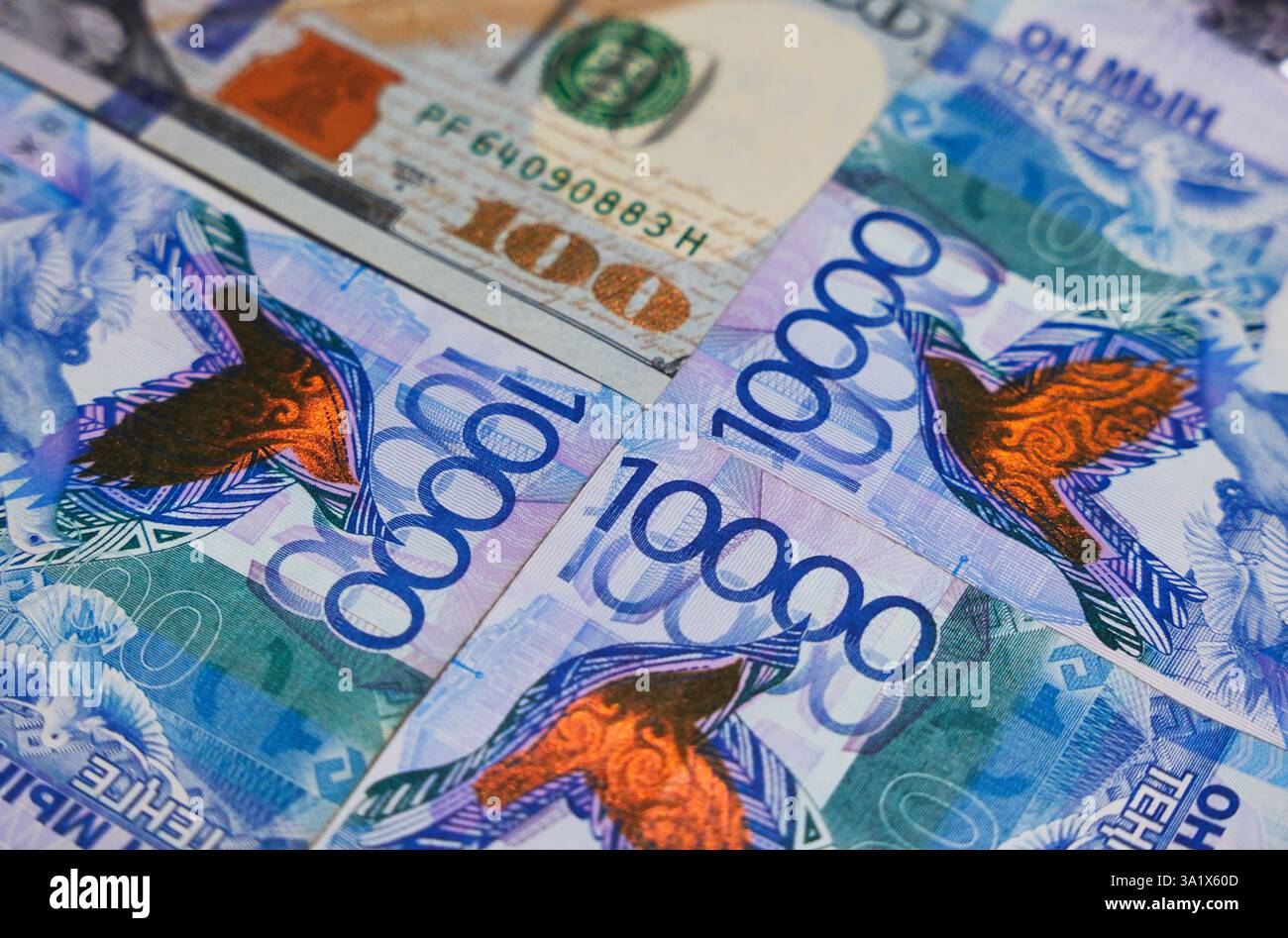 10,000 tenge and 100 dollars connected by corners. Currency exchange ...