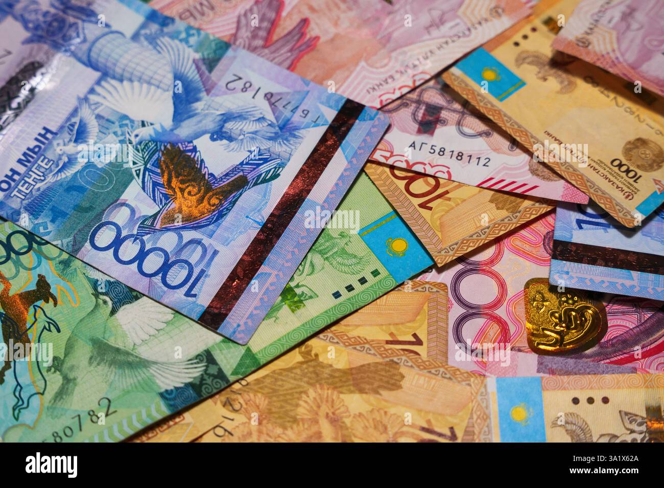 Large tenge banknotes of different denominations close-up. Accounting ...