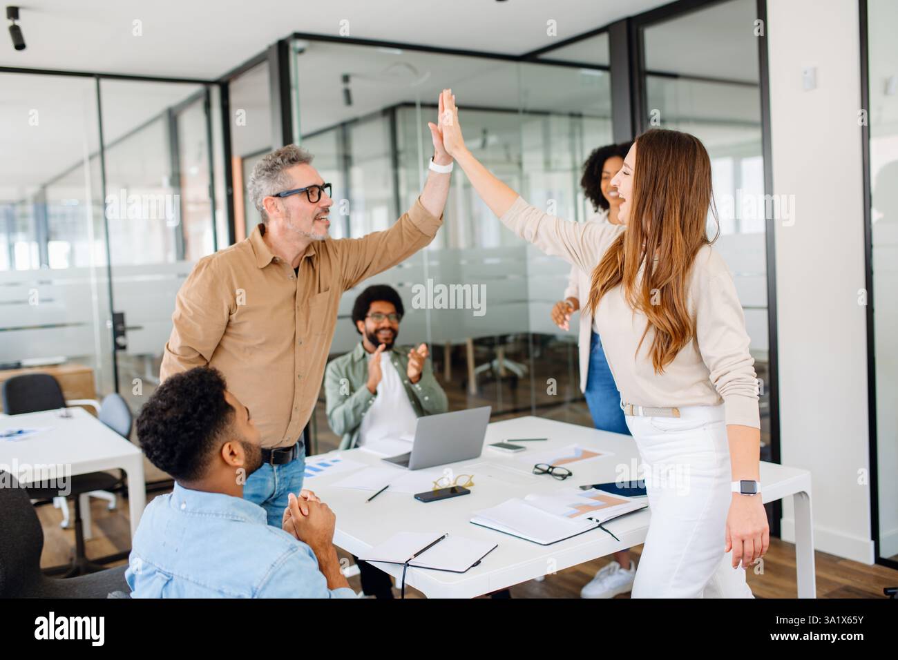 Young professionals embrace a culture of collaboration and achievement ...