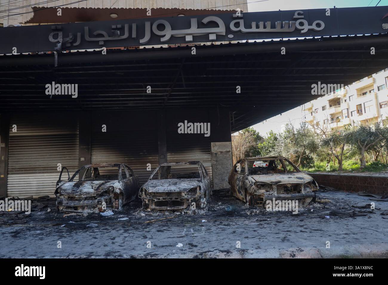 Burnt cars remain in an open garage following the recent wave of ...