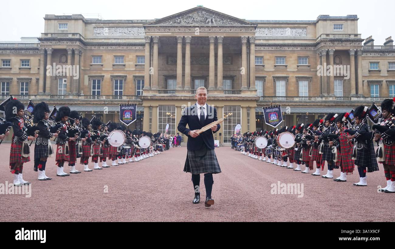 Sir Chris Hoy holding the Commonwealth baton at the launch of the ...