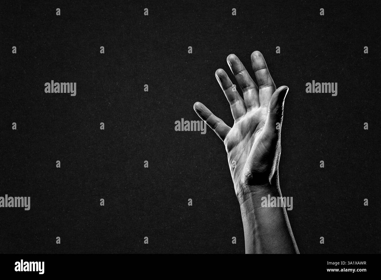 Hand Reaching Help Sign in Black and White on Textured Paper Background ...