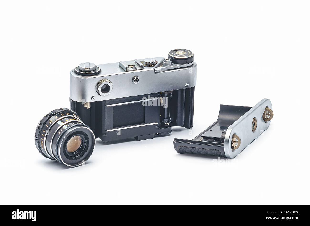 Old vintage camera disassembled on white background Stock Photo - Alamy