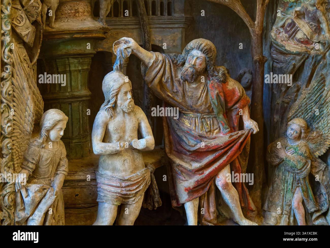Dijon, FRANCE - 01-30-2025: Stone bas relief (15th century) of Baptism of Jesus by John the ...