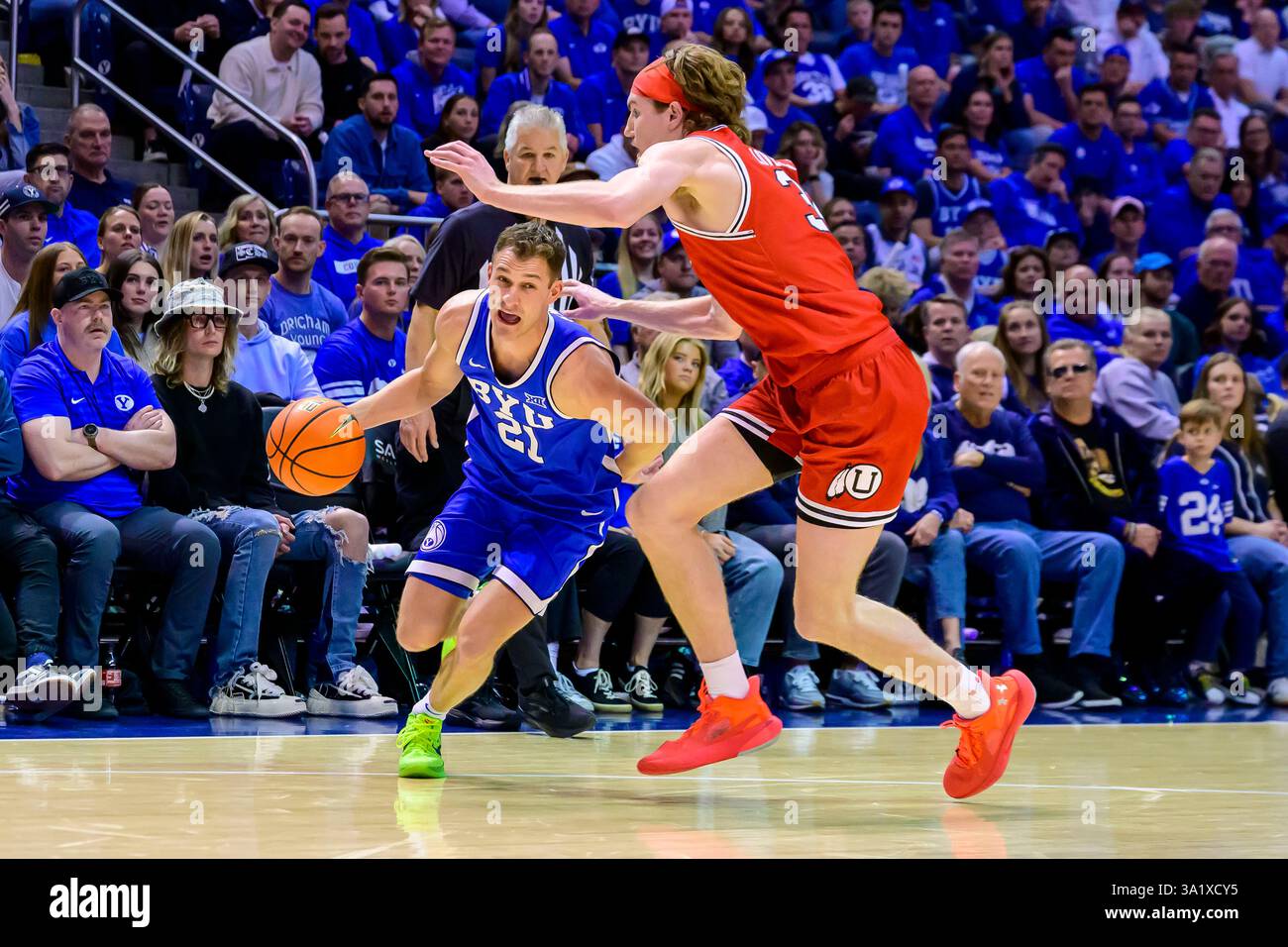 BYU guard Trevin Knell (21) dribbles the basketball guarded by Utah ...