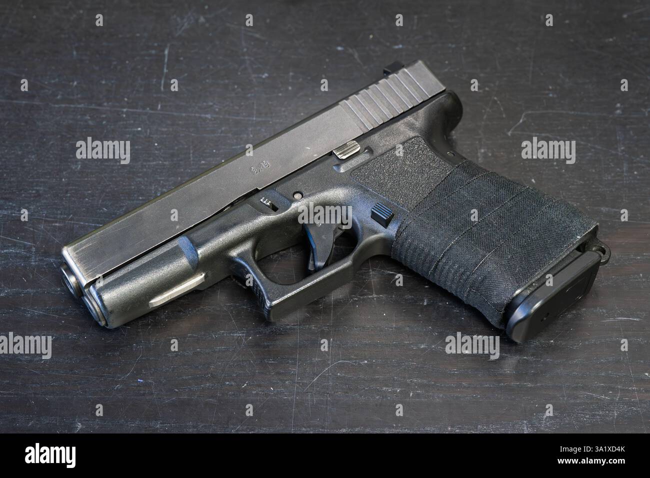 Used firearm, compact 9mm pistol with plastic frame Stock Photo - Alamy