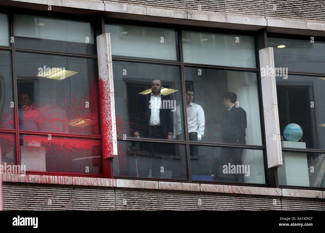 London, England, UK. 10th Mar, 2025. Workers from inside the paint ...