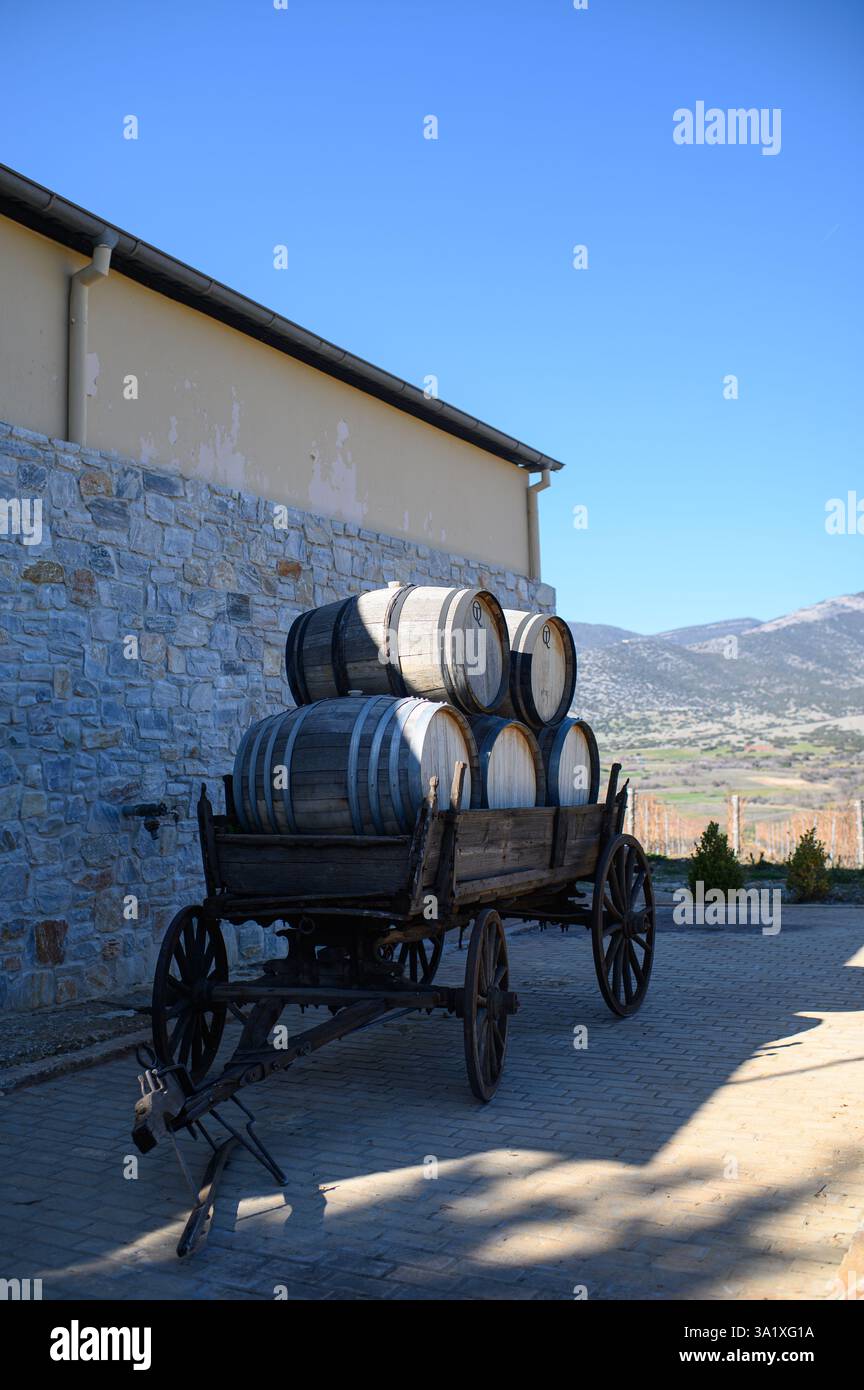Old Cart with Wine Barrels – A rustic wooden cart filled with wine ...