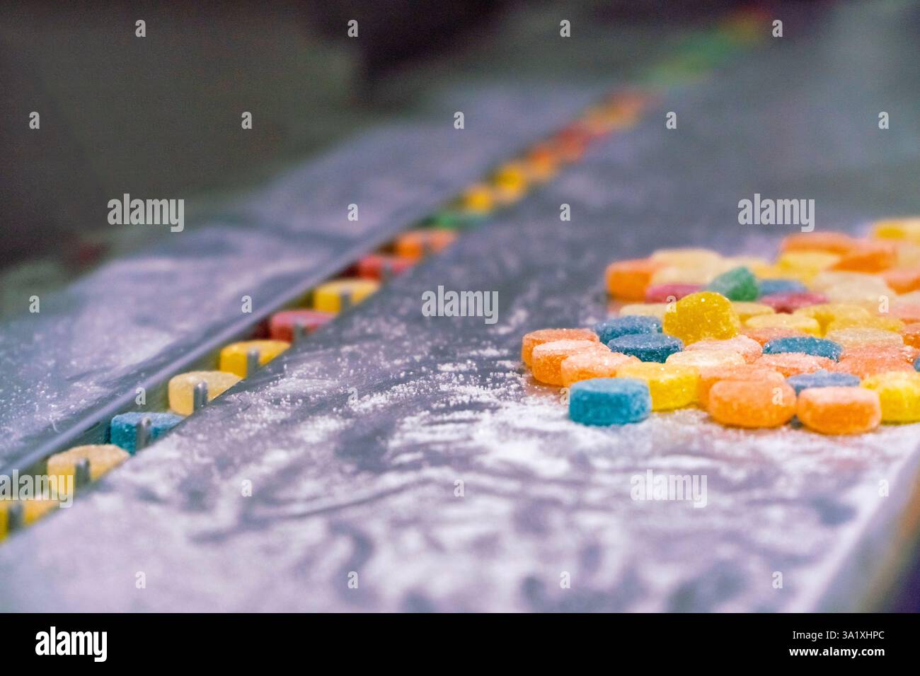 Production of colorful gummies on the industrial conveyor of the ...