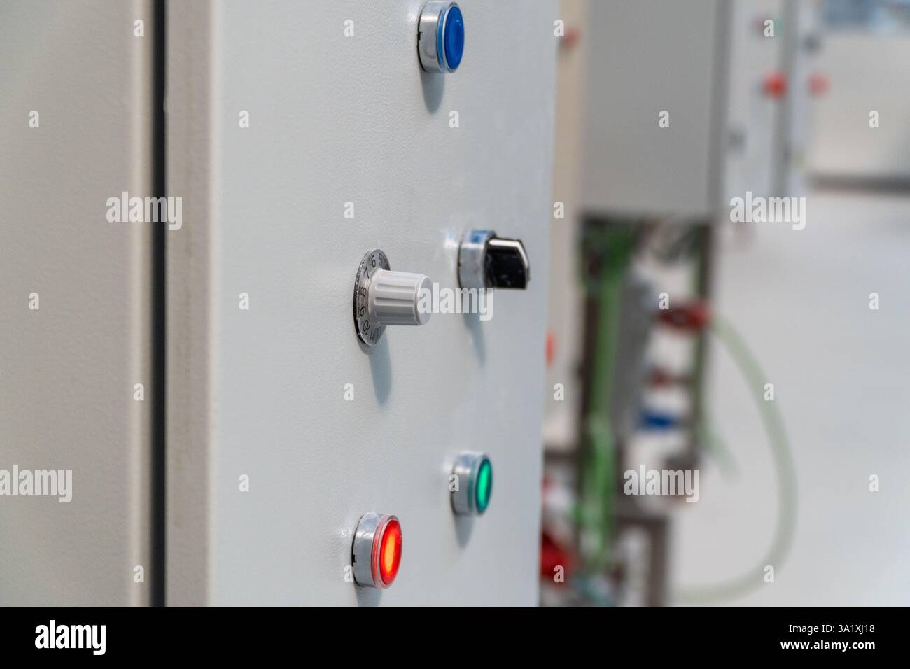 Industrial control panel with illuminated buttons and adjustment knobs ...