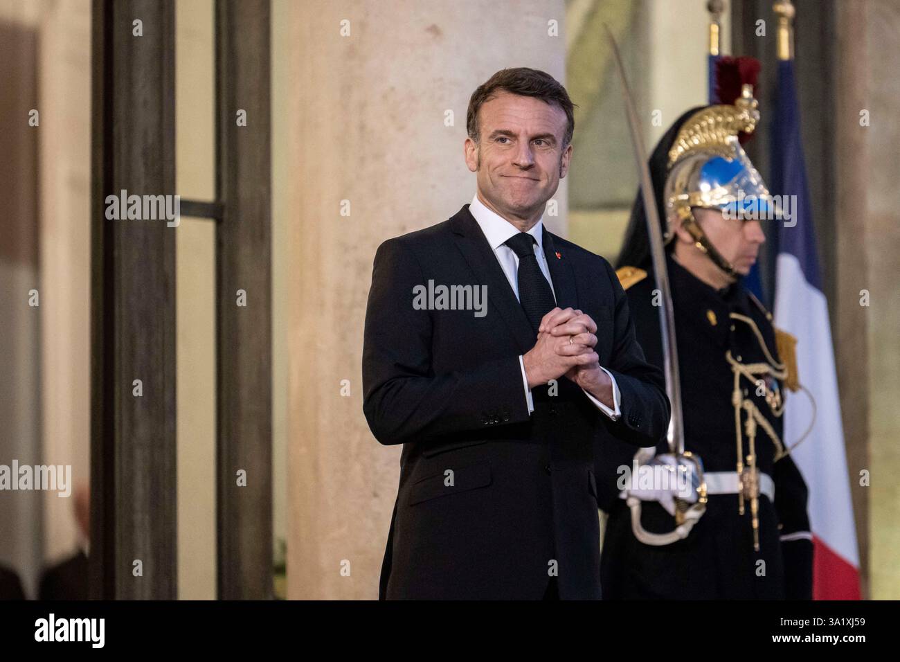 French President Emmanuel Macron smiles at the Elysee palace in Paris ...