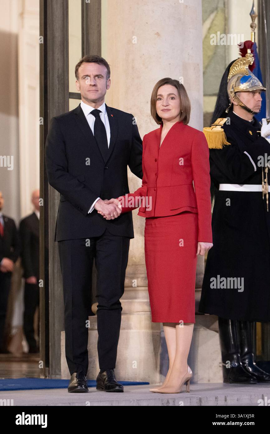 French President Emmanuel Macron shakes hands with Moldova's President ...