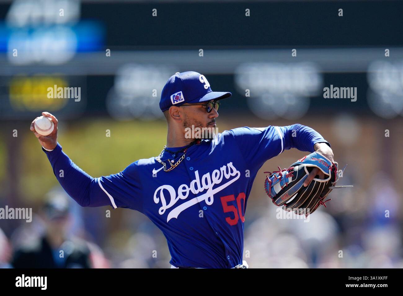 Los Angeles Dodgers shortstop Mookie Betts warms up prior to a spring ...