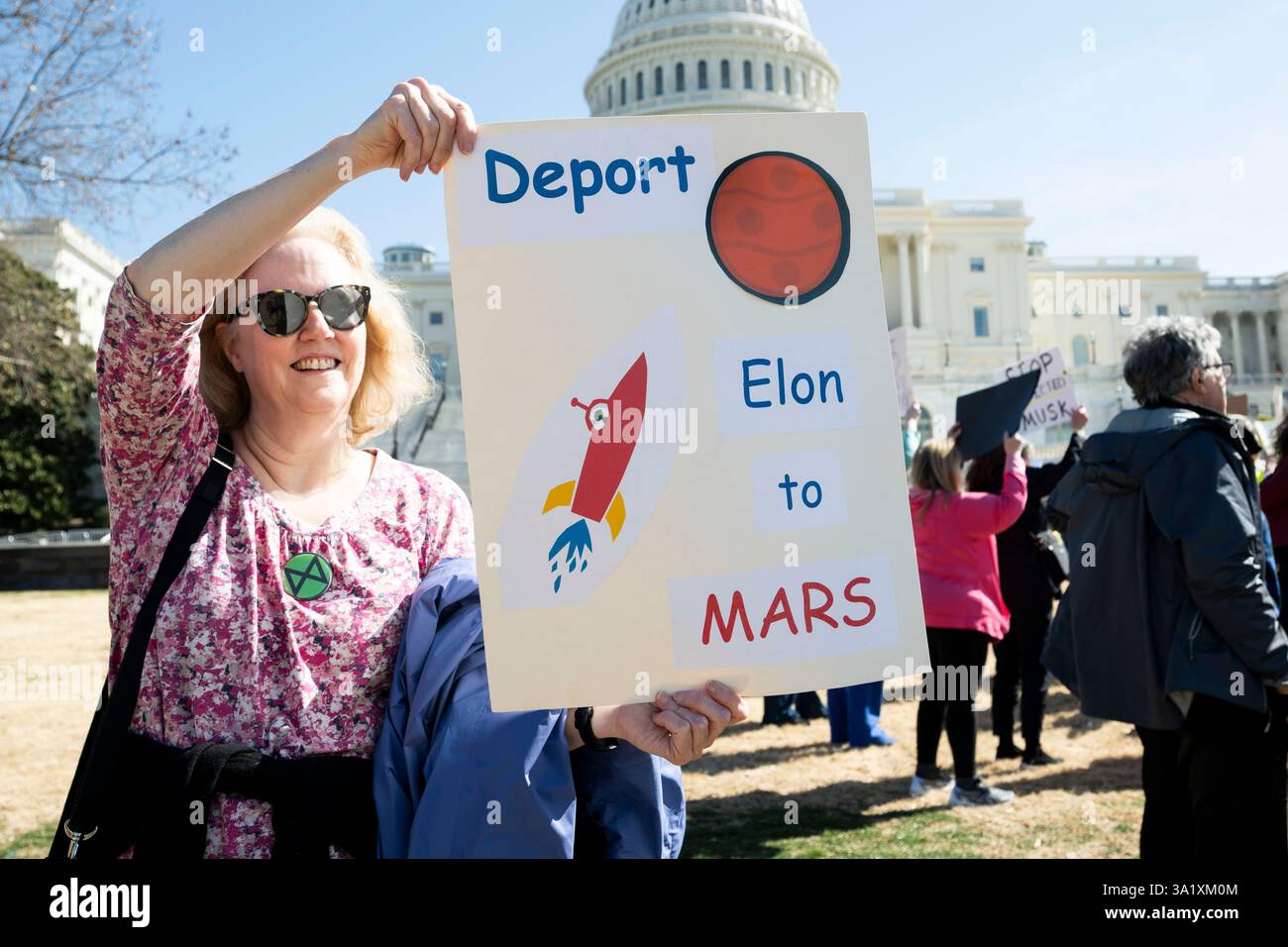 Washington, District Of Columbia, USA. 10th Mar, 2025. Woman holding a ...