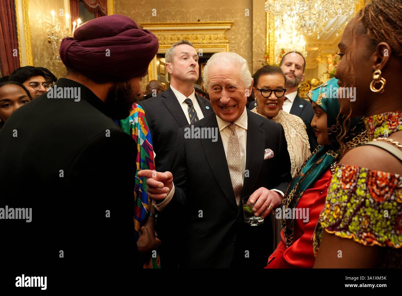 King Charles III (centre) speaks with guests as he attends the annual Commonwealth Day Reception ...