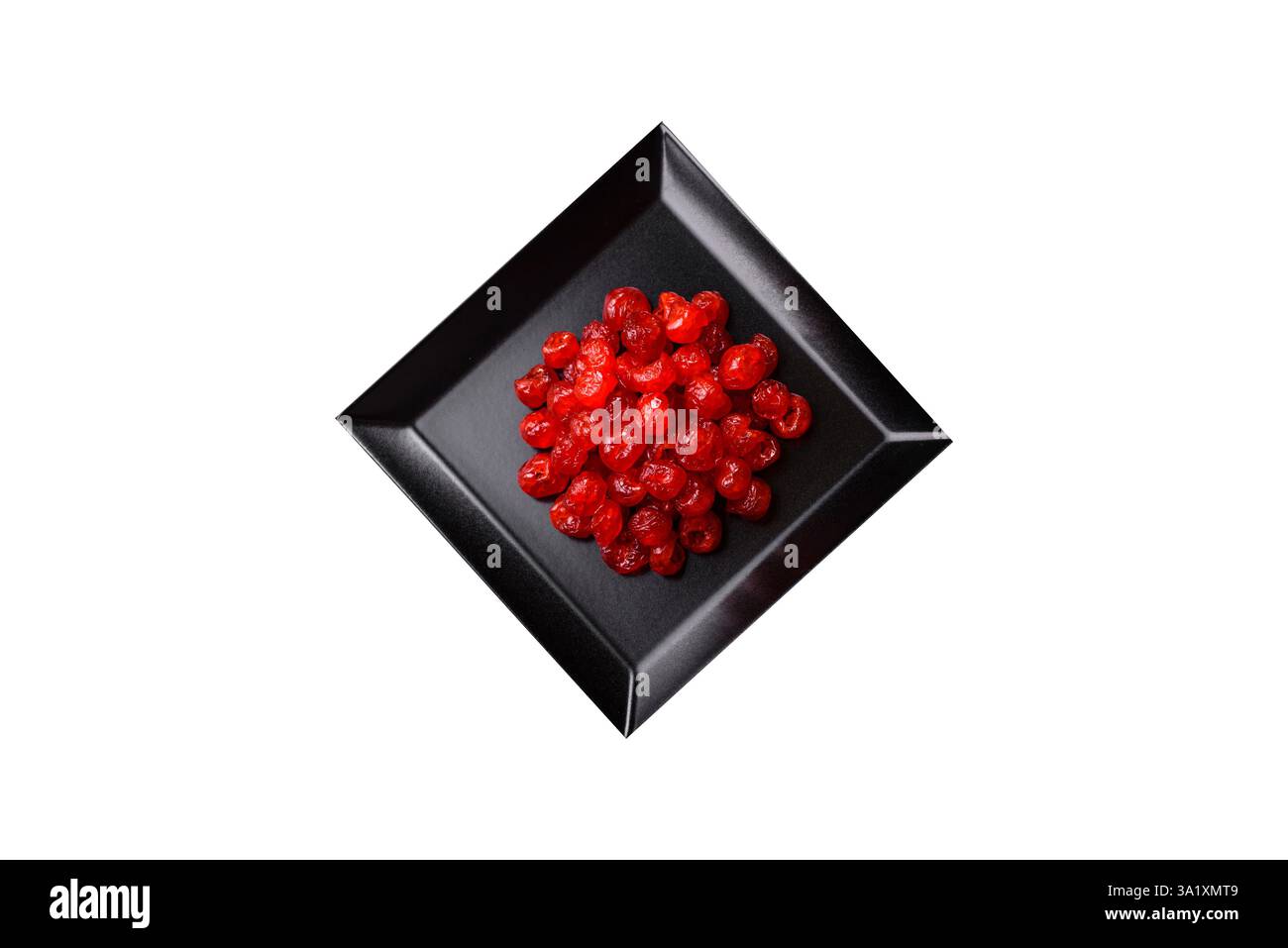 Dried sweet red pitted cherries or candied fruits on white background ...
