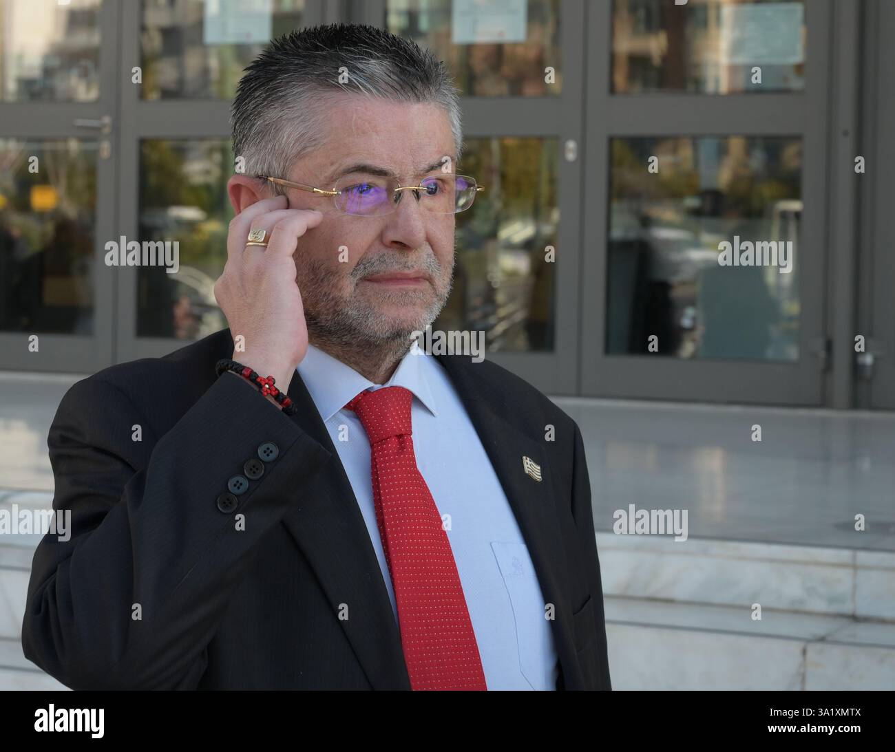 Athens, Greece, 10 March 2025. MP Pavlos Sarakis stands outside of the ...