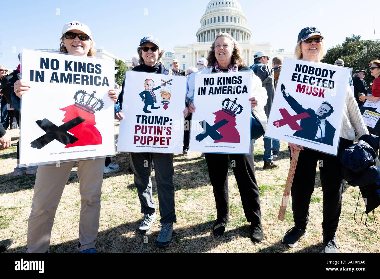 People holding signs saying "No kings in America", "Trump: Putin's ...