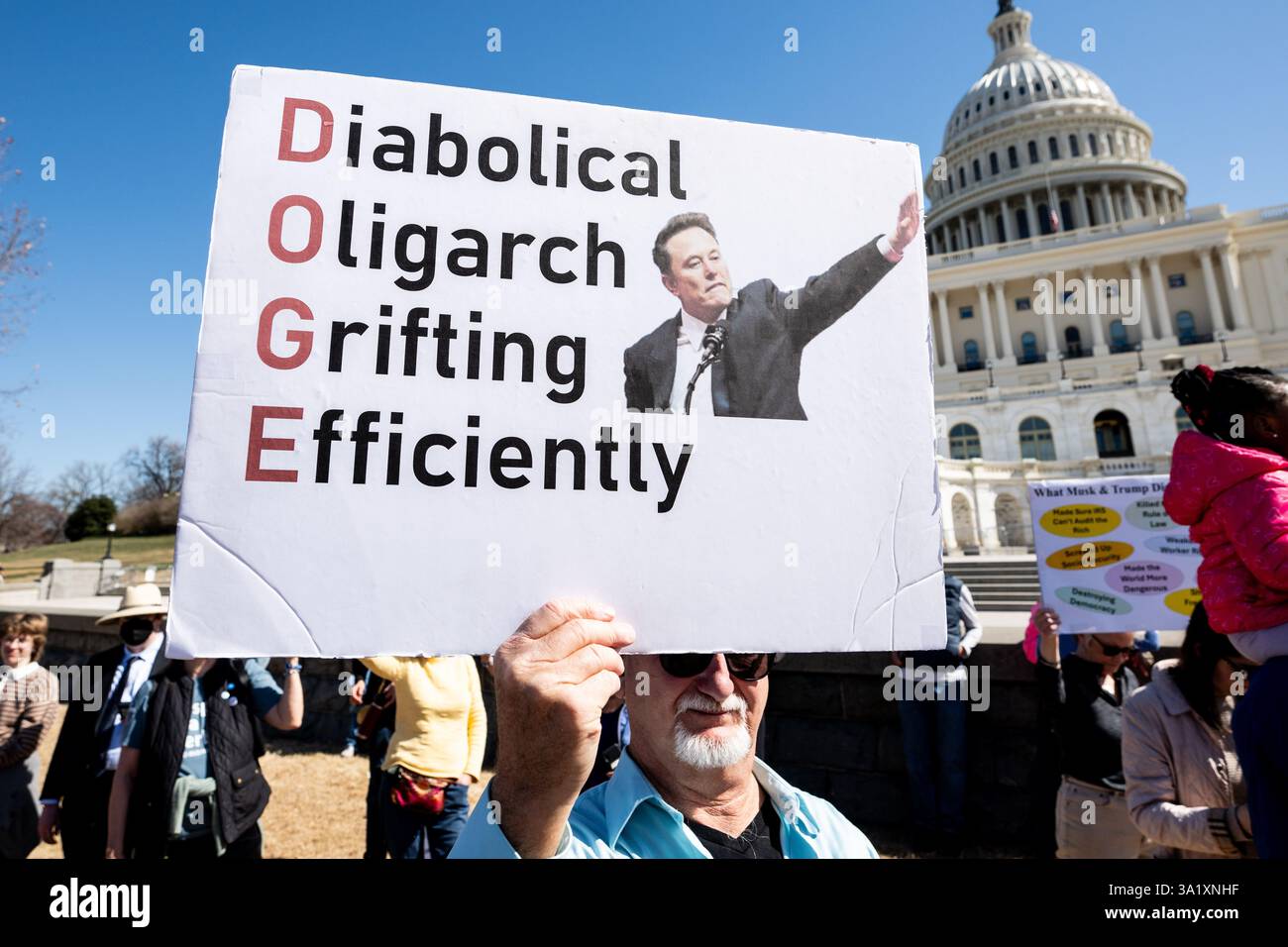 Washington, United States. 10th Mar, 2025. A man holding a sign saying ...