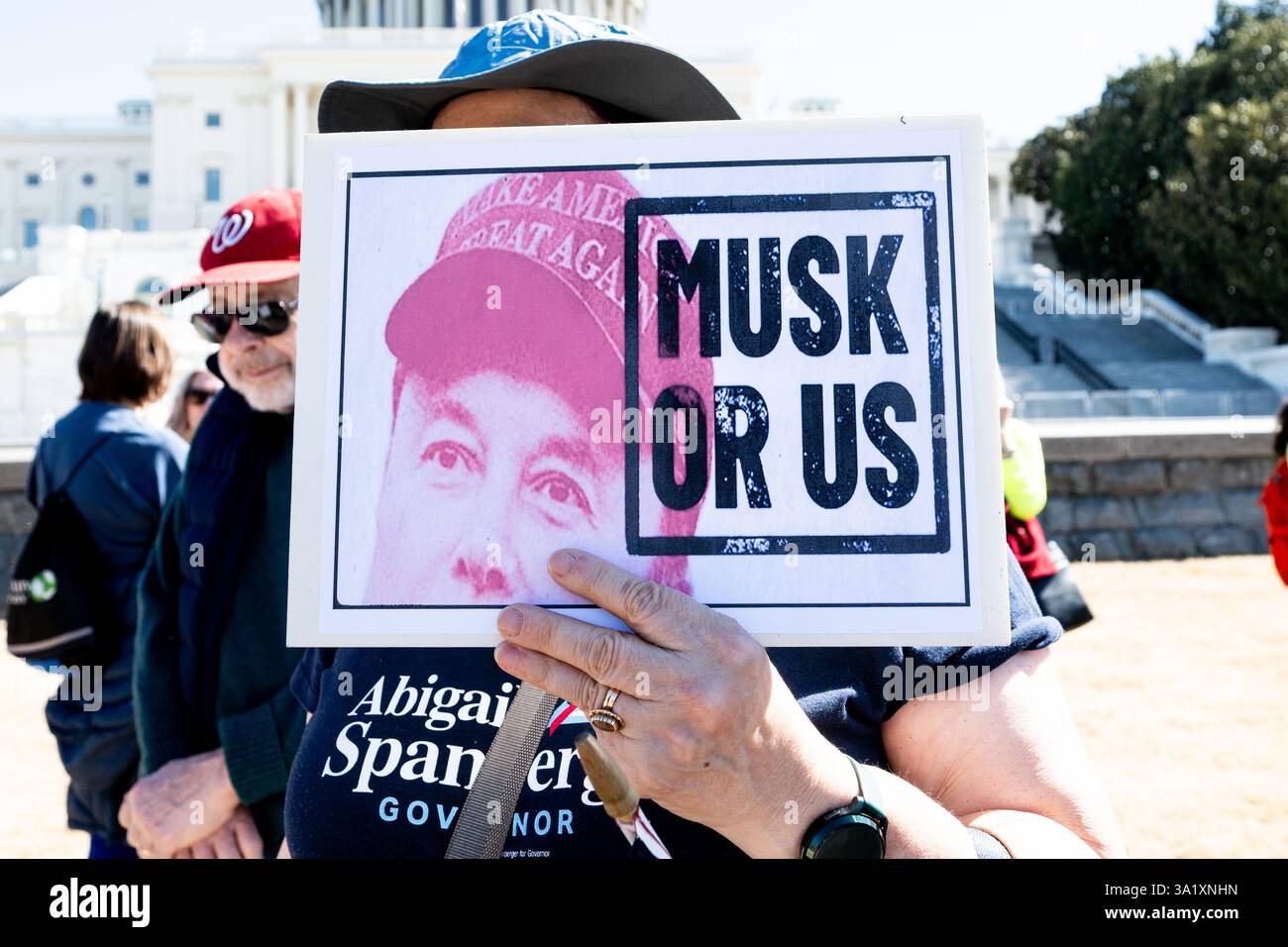 Washington, United States. 10th Mar, 2025. A woman holding a sign ...