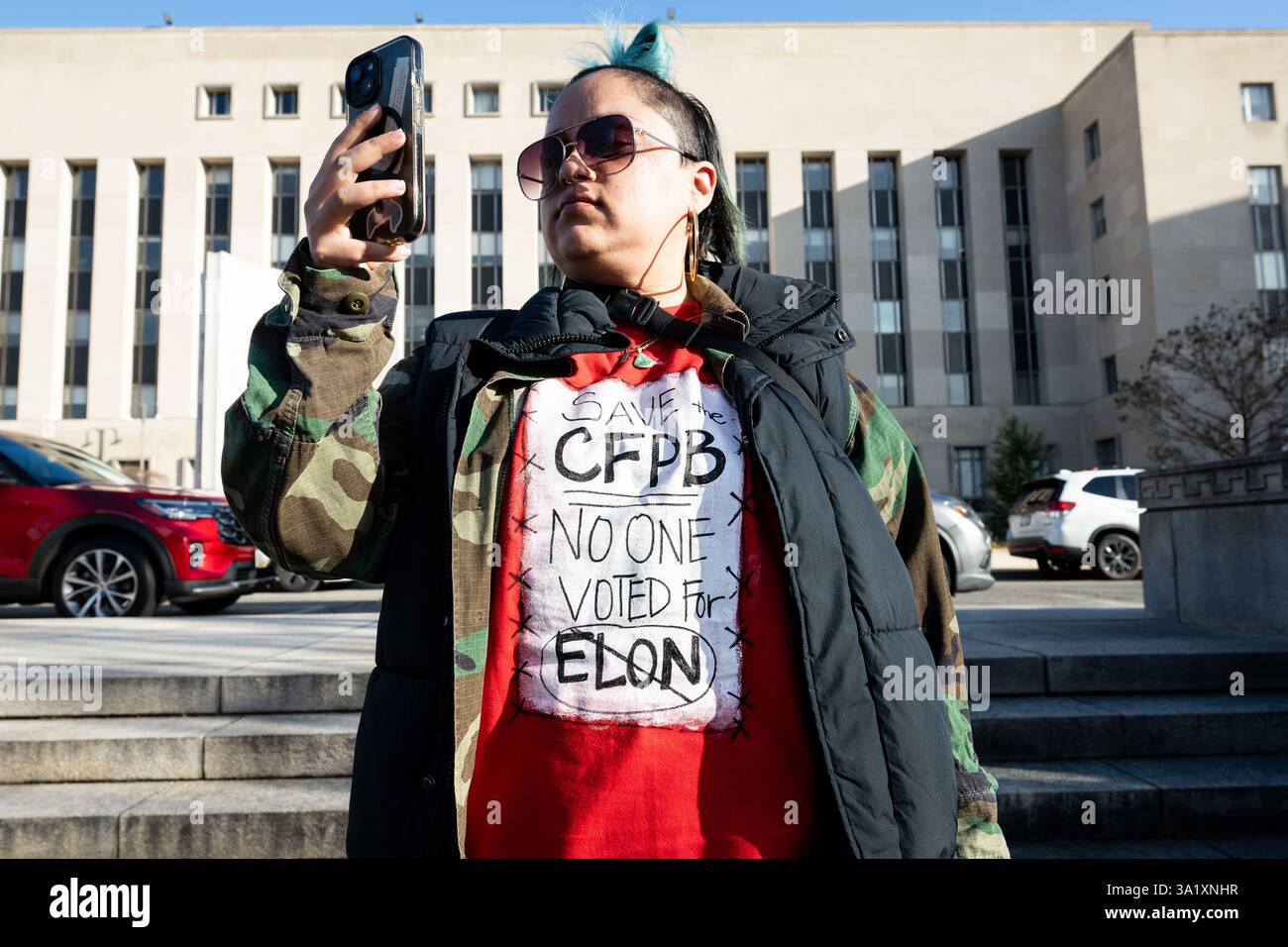 Washington, United States. 10th Mar, 2025. A person with a shirt saying ...