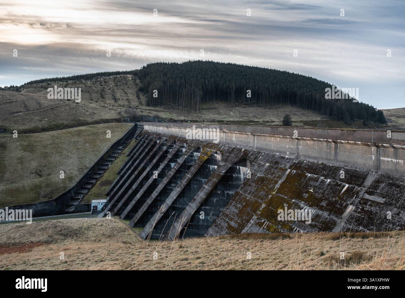 The dam at Nant-y-Moch reservoir standing proud above the Afon Rheidol ...