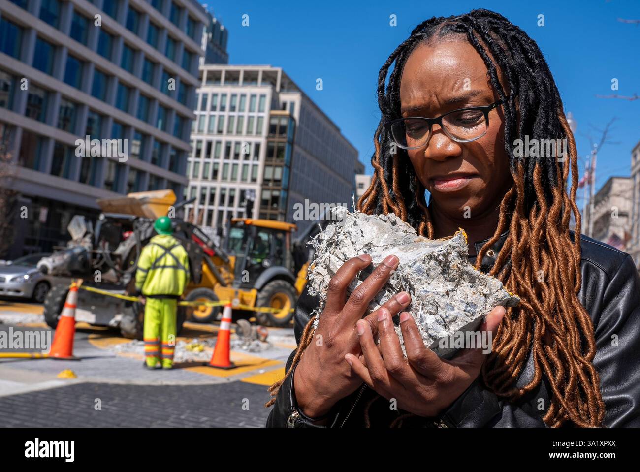 Tears roll down the face of Starlette Thomas, of Bowie, Md., as she ...