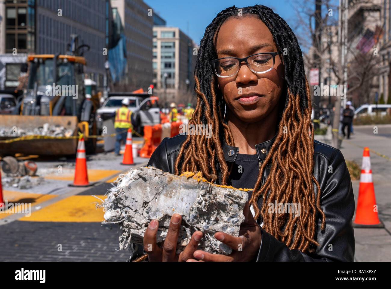 Tears roll down the face of Starlette Thomas, of Bowie, Md., as she ...