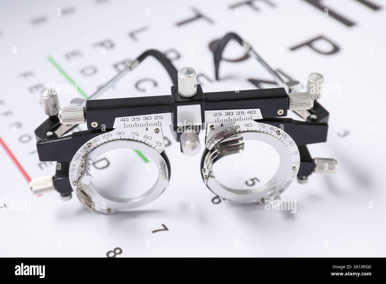 Trial frame on vision test chart, closeup Stock Photo - Alamy