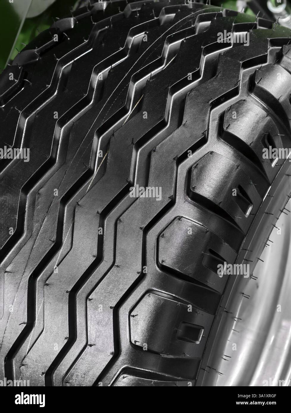 Detailed view of agricultural machinery wheels showcasing rugged tread ...