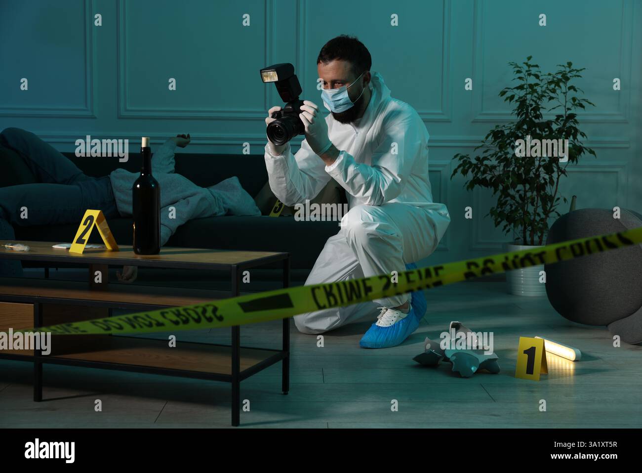 Forensic expert with camera working at crime scene and dead woman's ...
