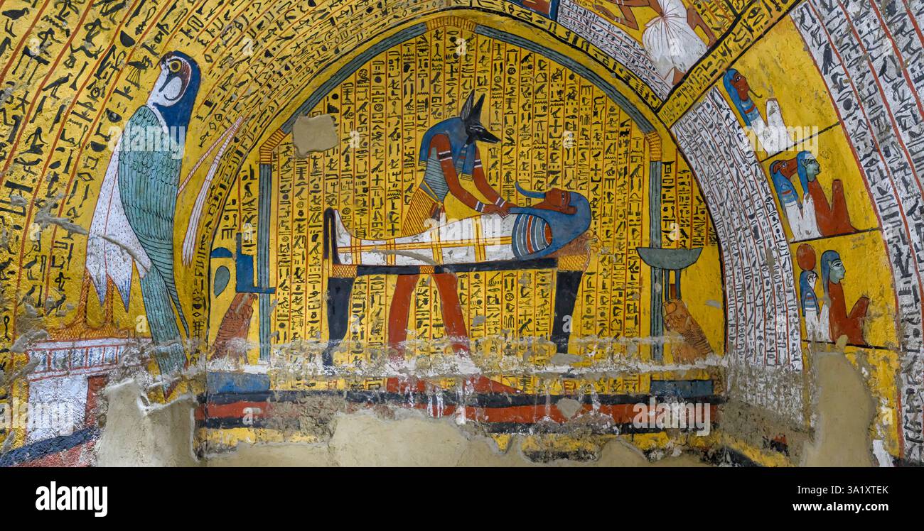 A priest wearing the mask of Anubis completes the mummification of ...