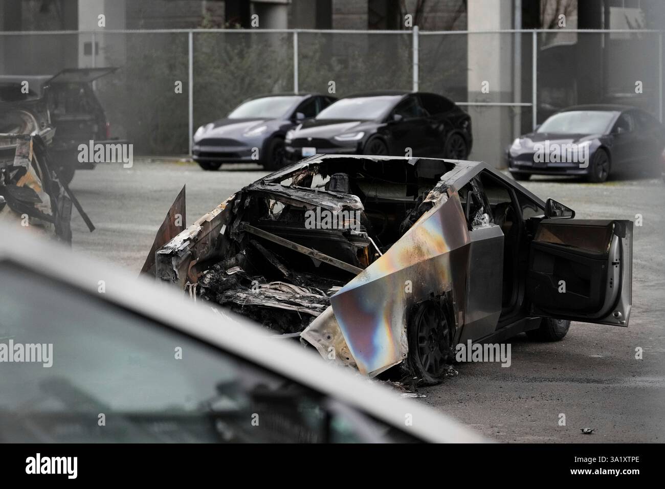 A burned Tesla Cybertruck is parked at a Tesla lot in Seattle, Monday ...