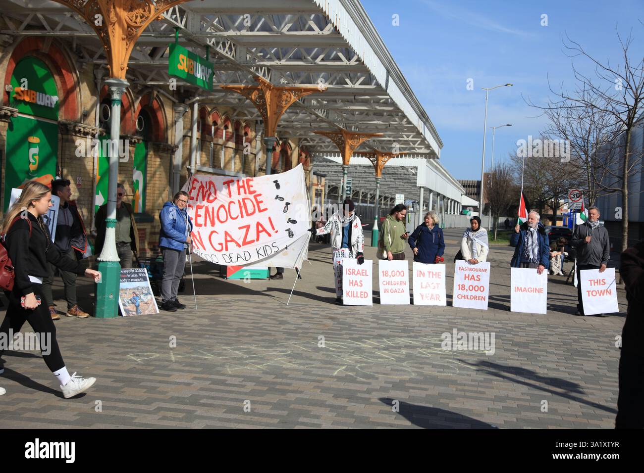 “End The Genocide in Gaza” outside Eastbourne Station in the UK, people ...