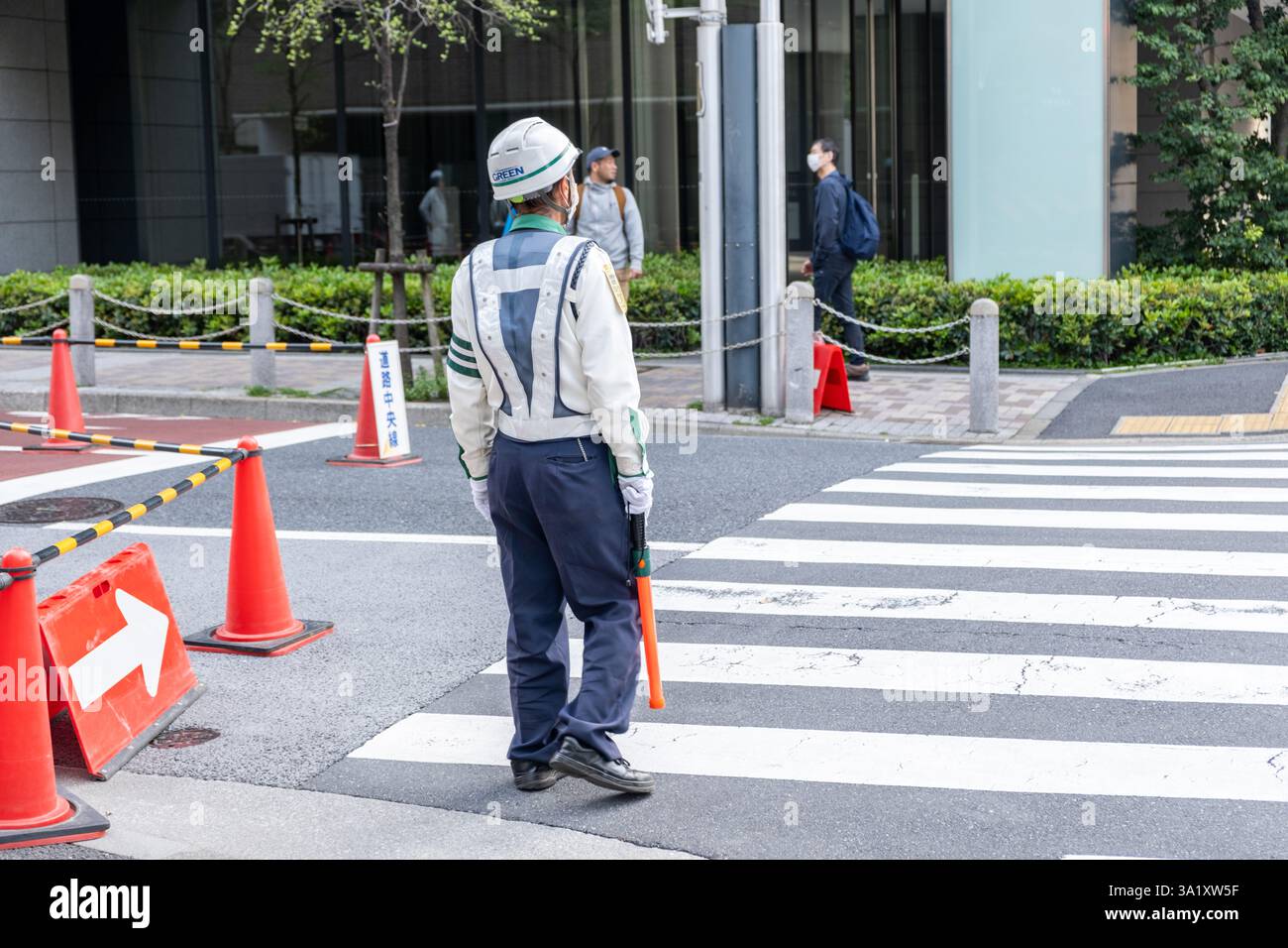 Japan Tokyo. April 13, 2024. Japanese traffic control system. Worker on ...