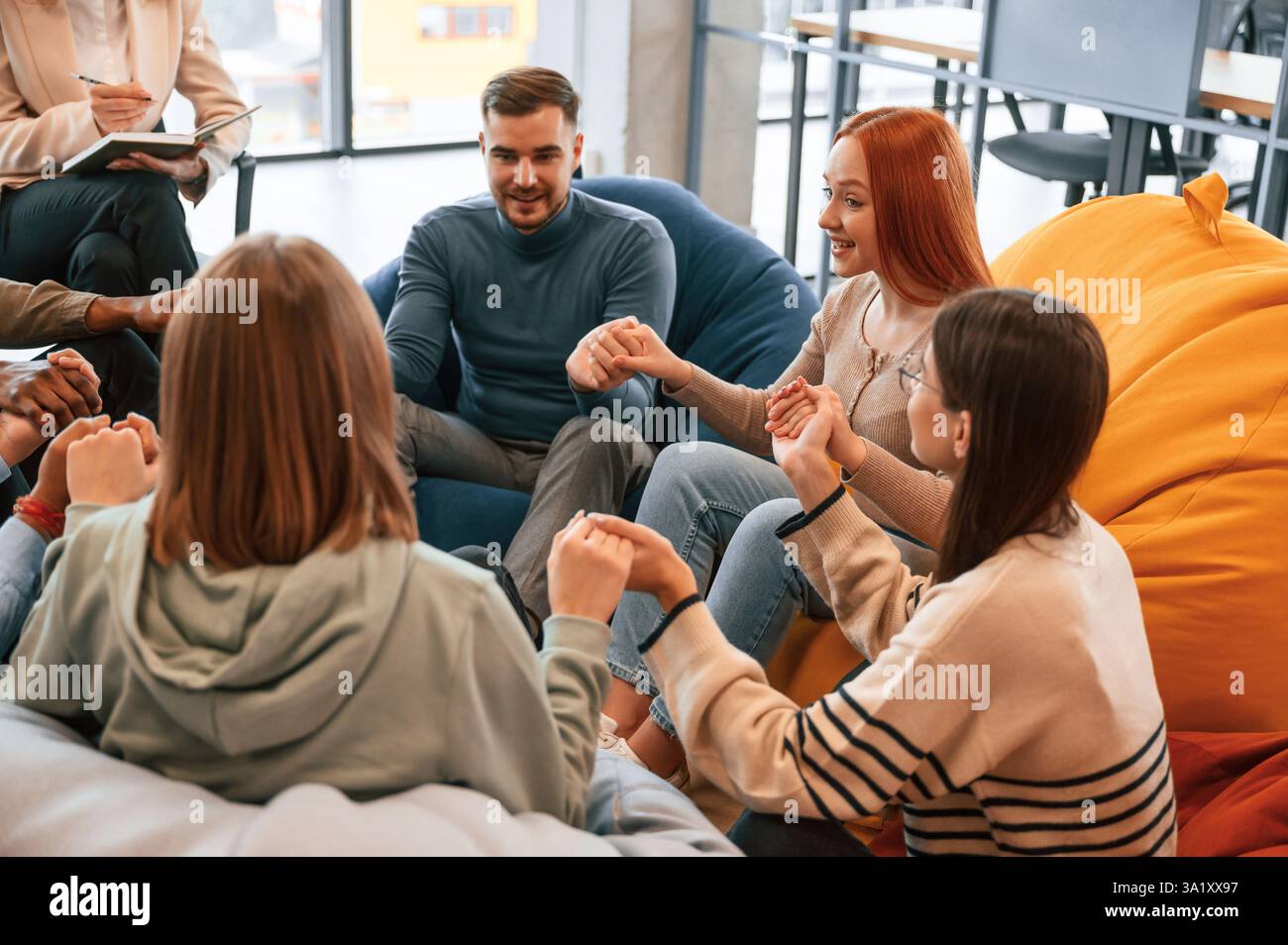 Talking, helping each other. Group of people are having therapy meeting ...