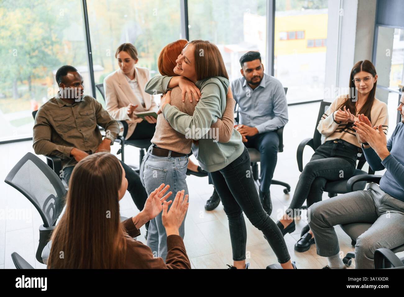 Greeting each other. Group of people are having therapy meeting ...